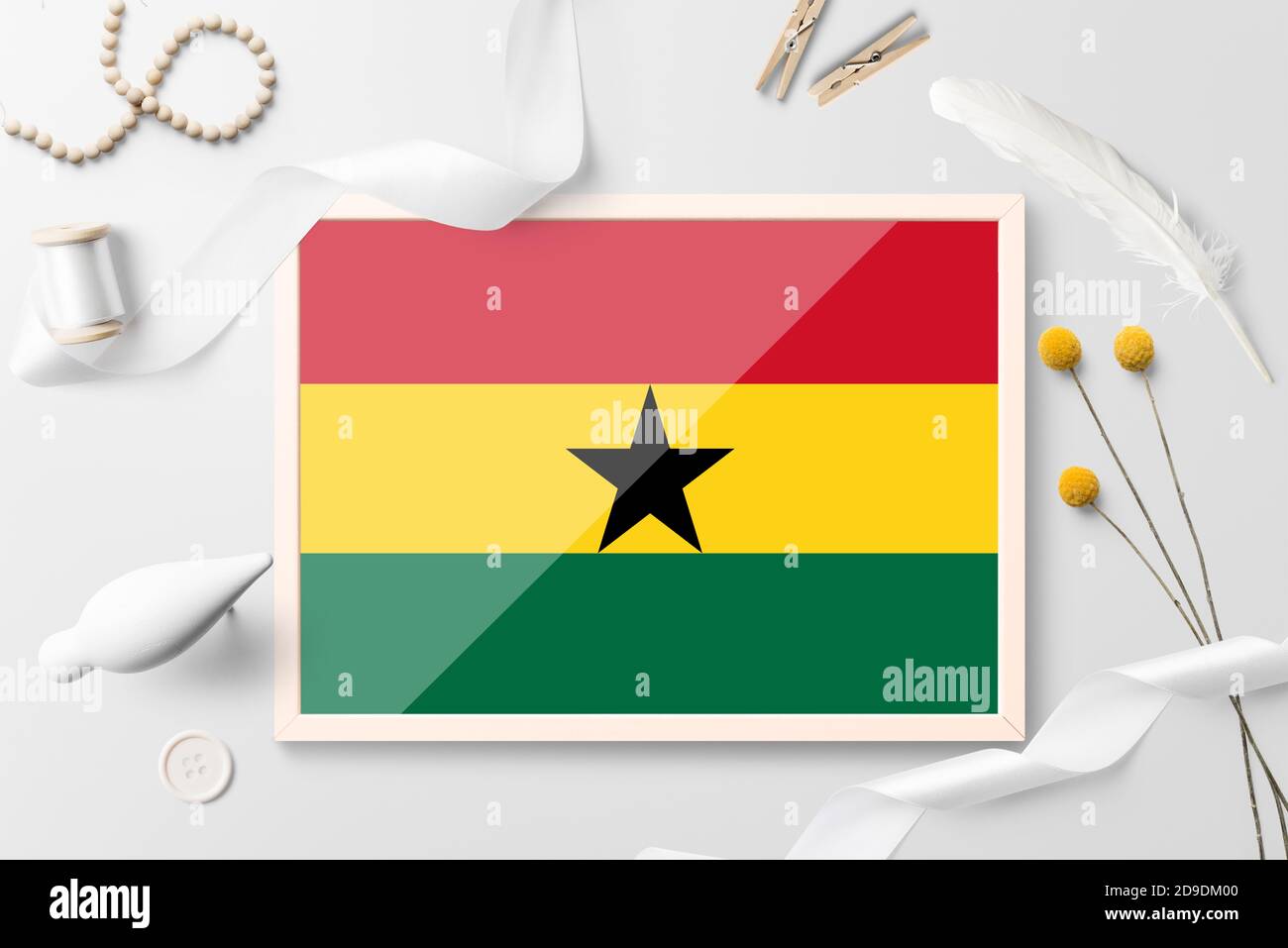 Ghana flag in wooden frame on white creative background. White theme ...