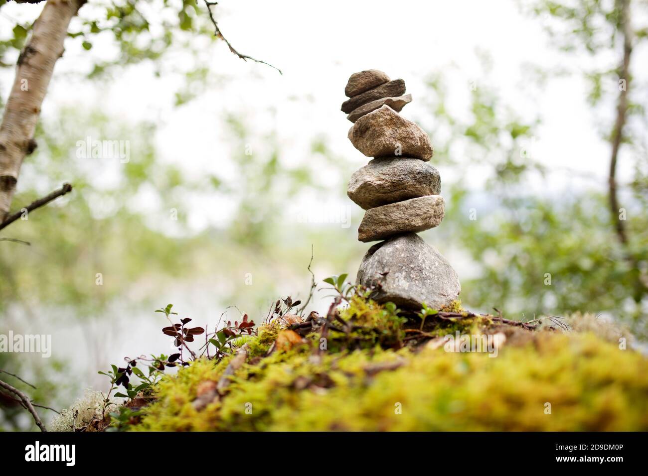 Rocks stacked up cairns one another in nature Stock Photo - Alamy