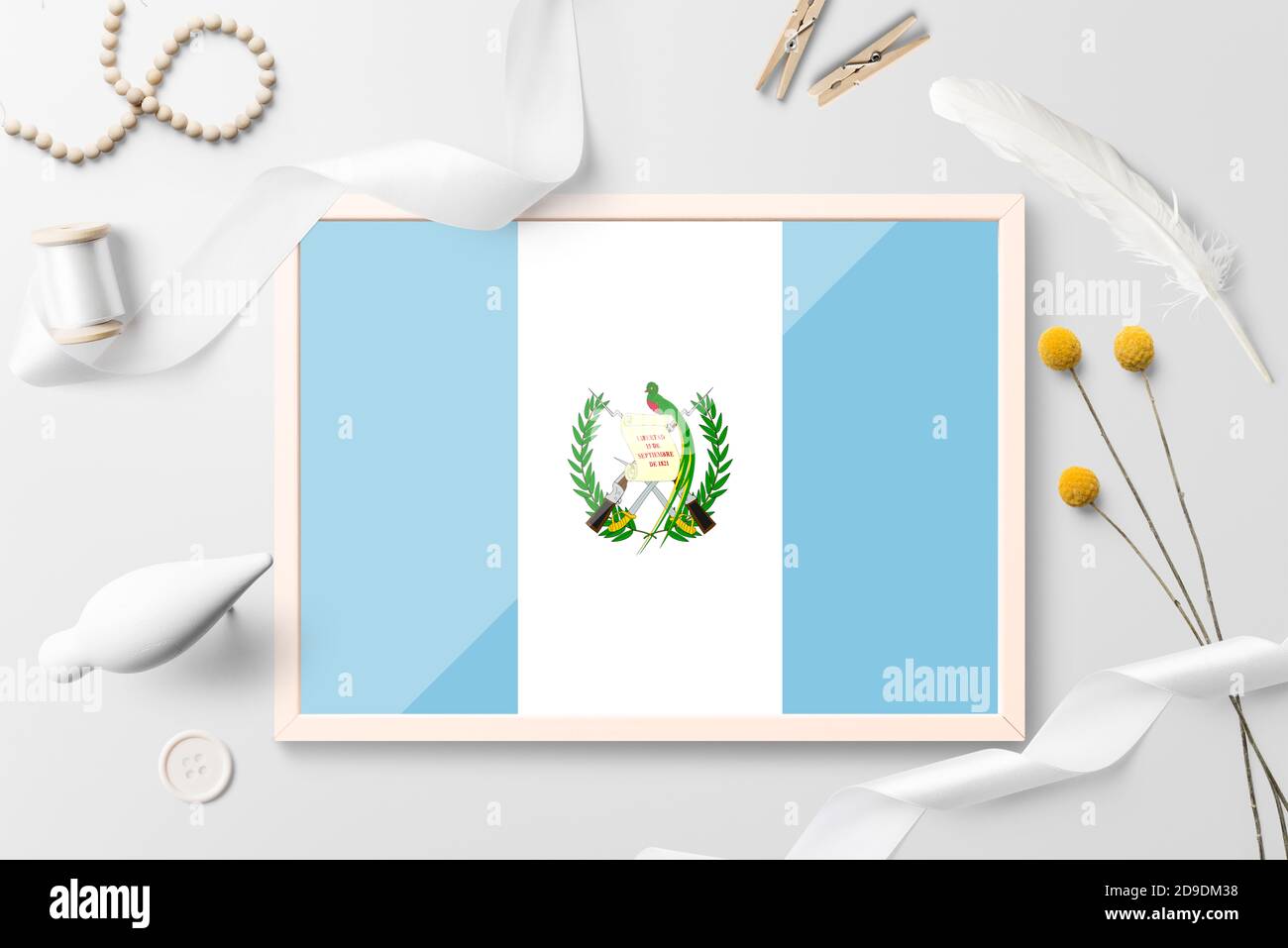 Guatemala flag in wooden frame on white creative background. White ...