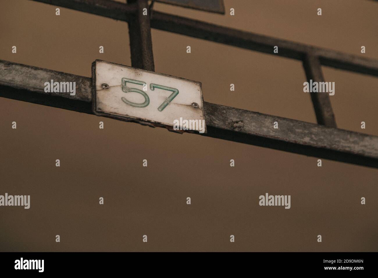 Fifty seven address plate on an iron material Stock Photo - Alamy
