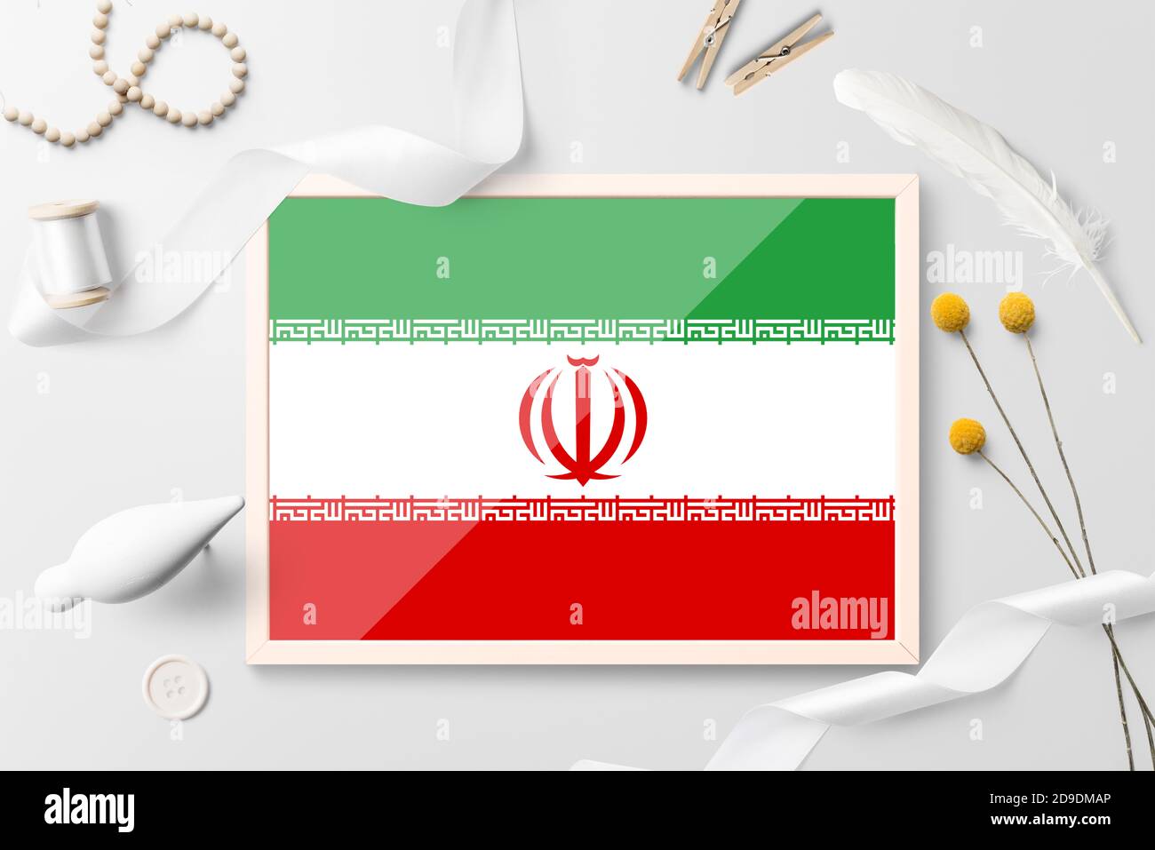 Iran flag in wooden frame on white creative background. White theme ...