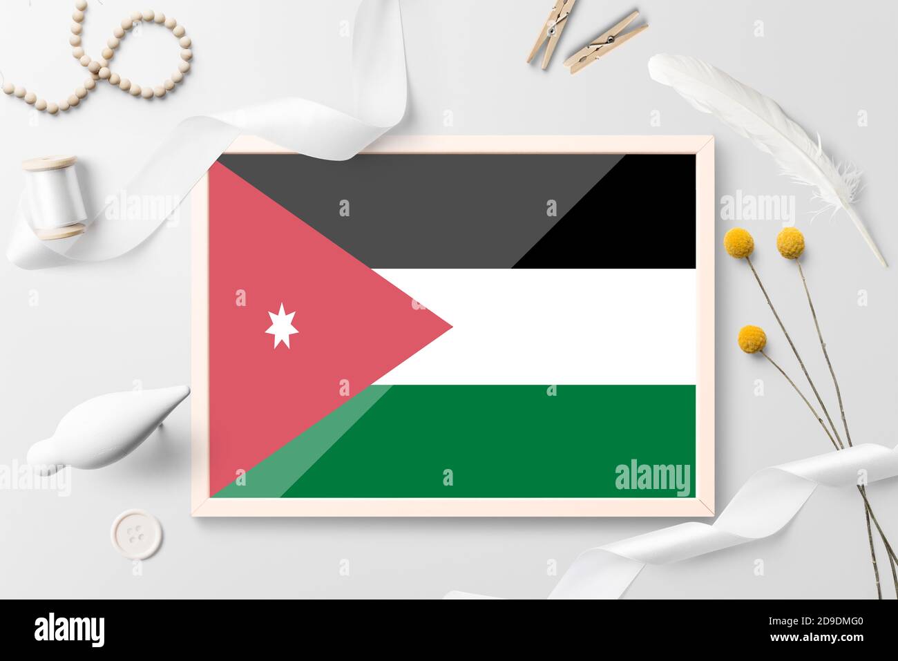 Jordan flag in wooden frame on white creative background. White theme ...