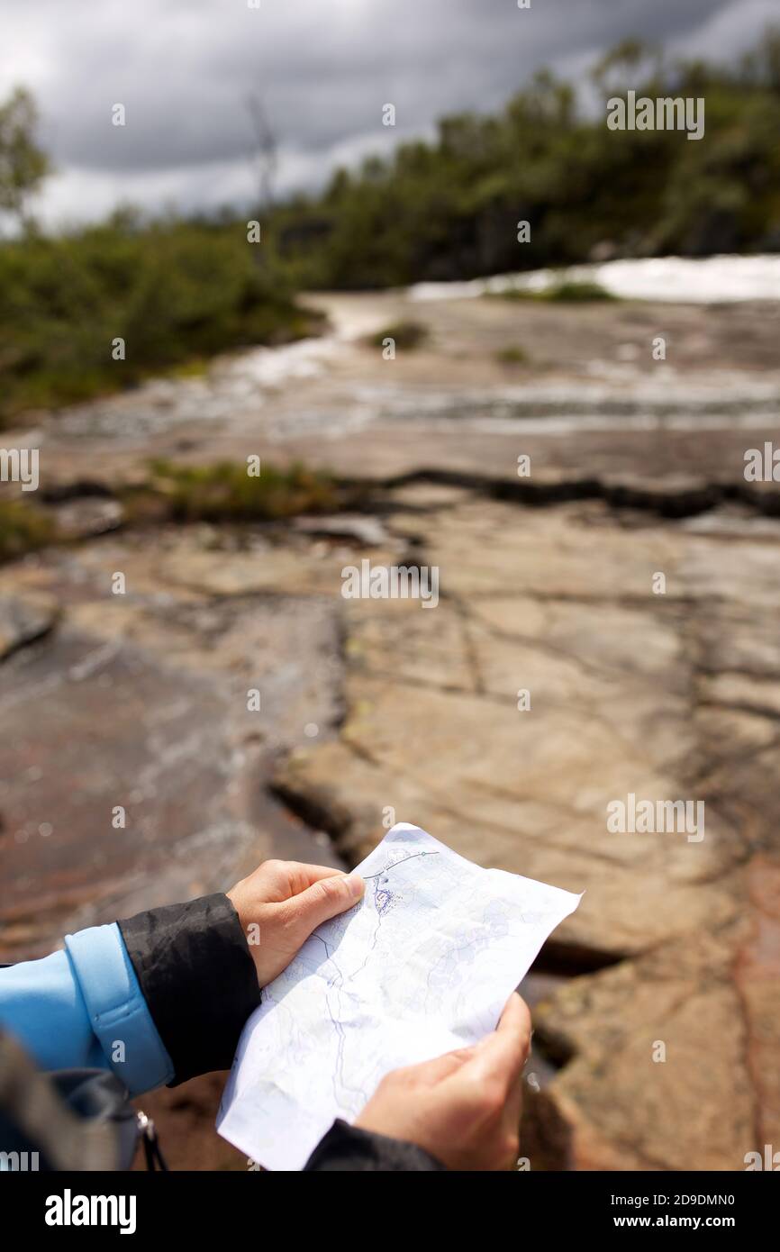 Close up portrait hands holding map orientation Stock Photo - Alamy