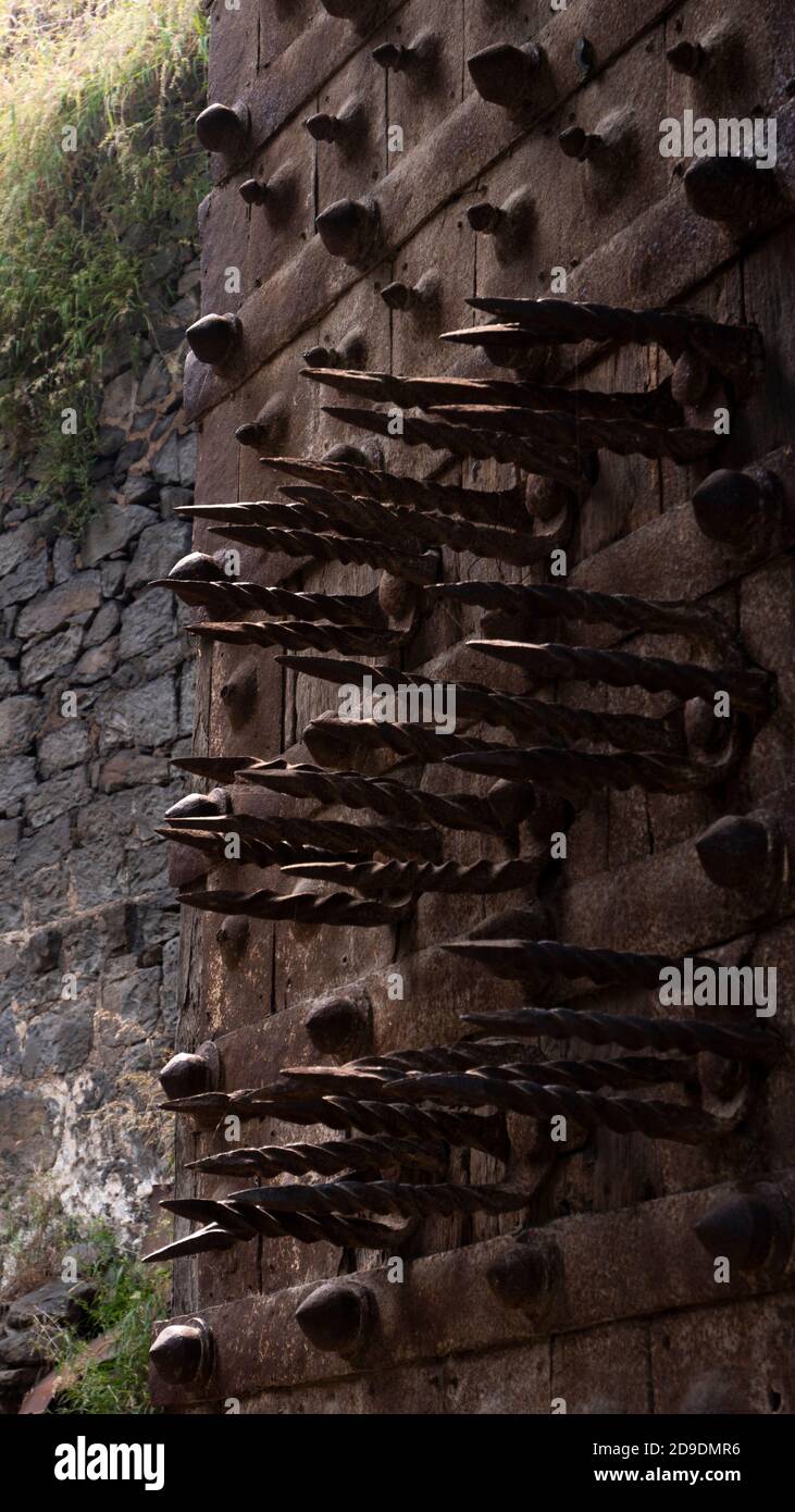 a close view of door spikes isolated in Kalaburagi fort back entrance ...
