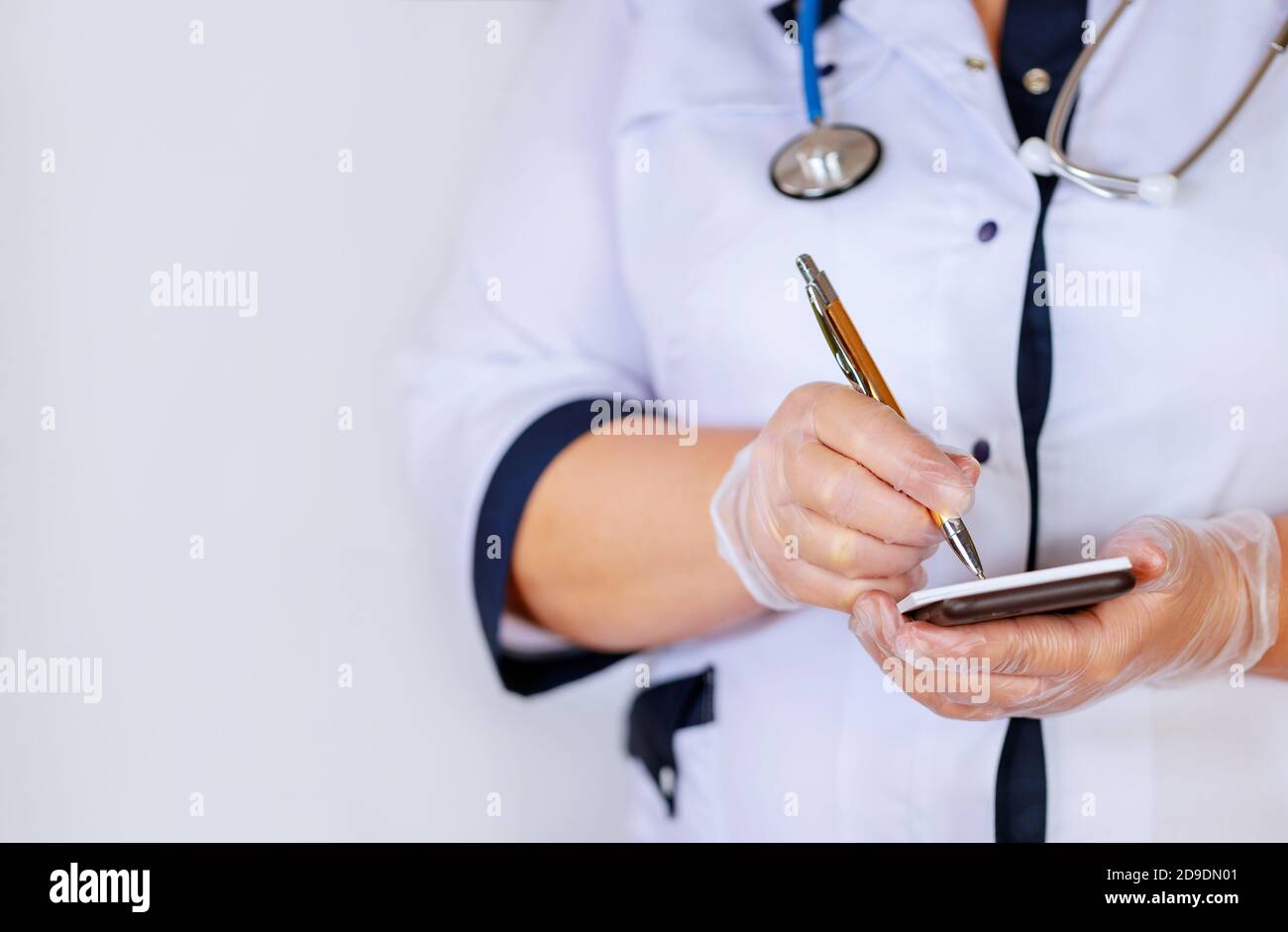 Close up of female hands nurse handwrite hospital in medical at ...
