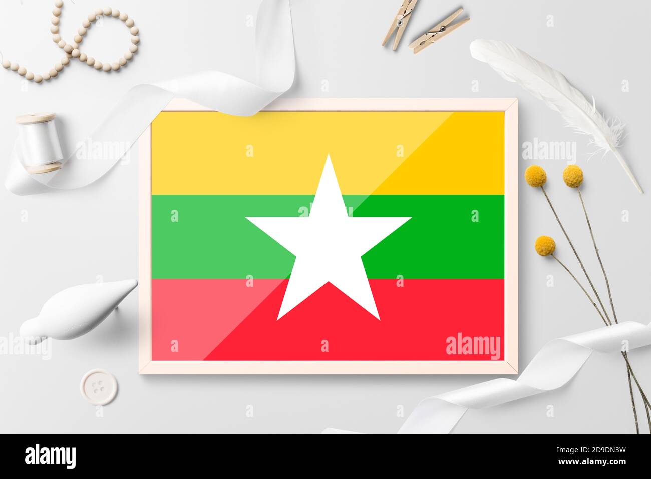 Myanmar flag in wooden frame on white creative background. White theme ...