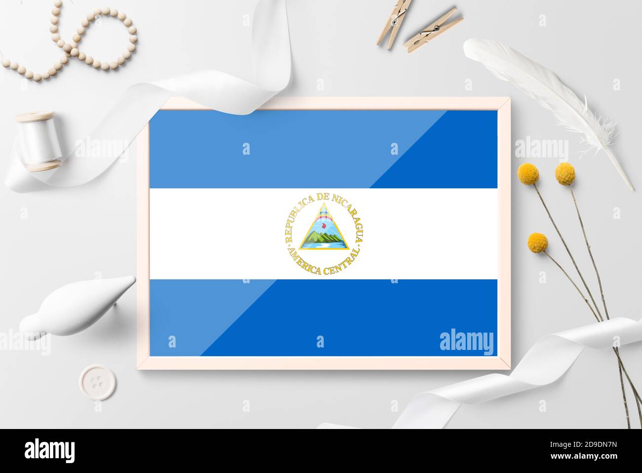 Nicaragua flag in wooden frame on white creative background. White ...