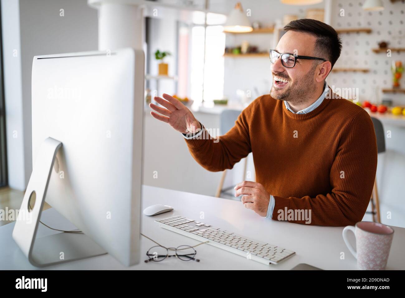 Man having video conferencing call via computer. Working remotely ...