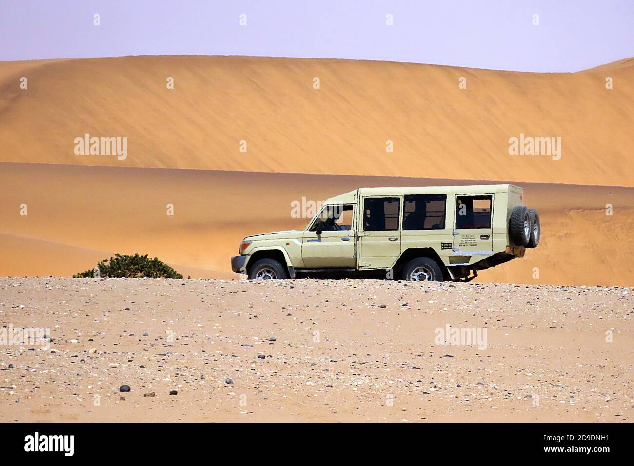 Off road driving in the desert sand dunes of the Dorob National Park on ...