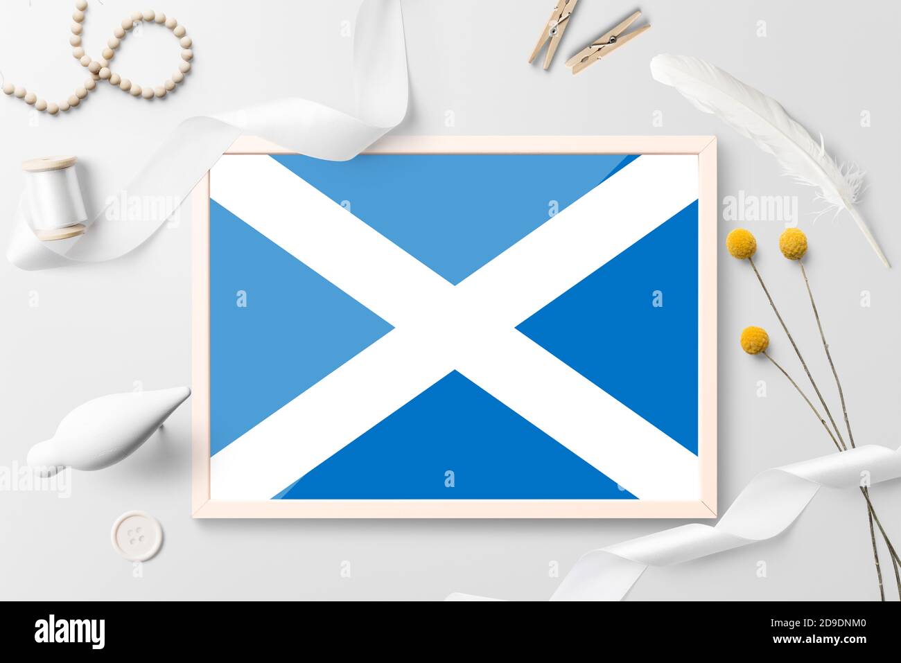 Scotland flag in wooden frame on white creative background. White theme ...