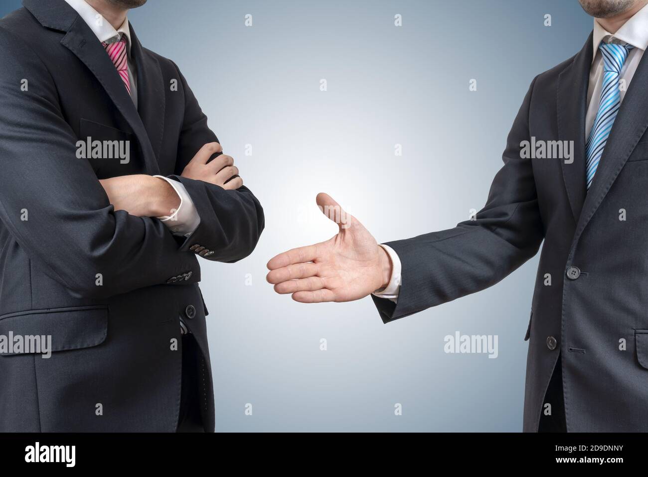 Handshake refuse. Man is refusing shake hand with businessman who is ...