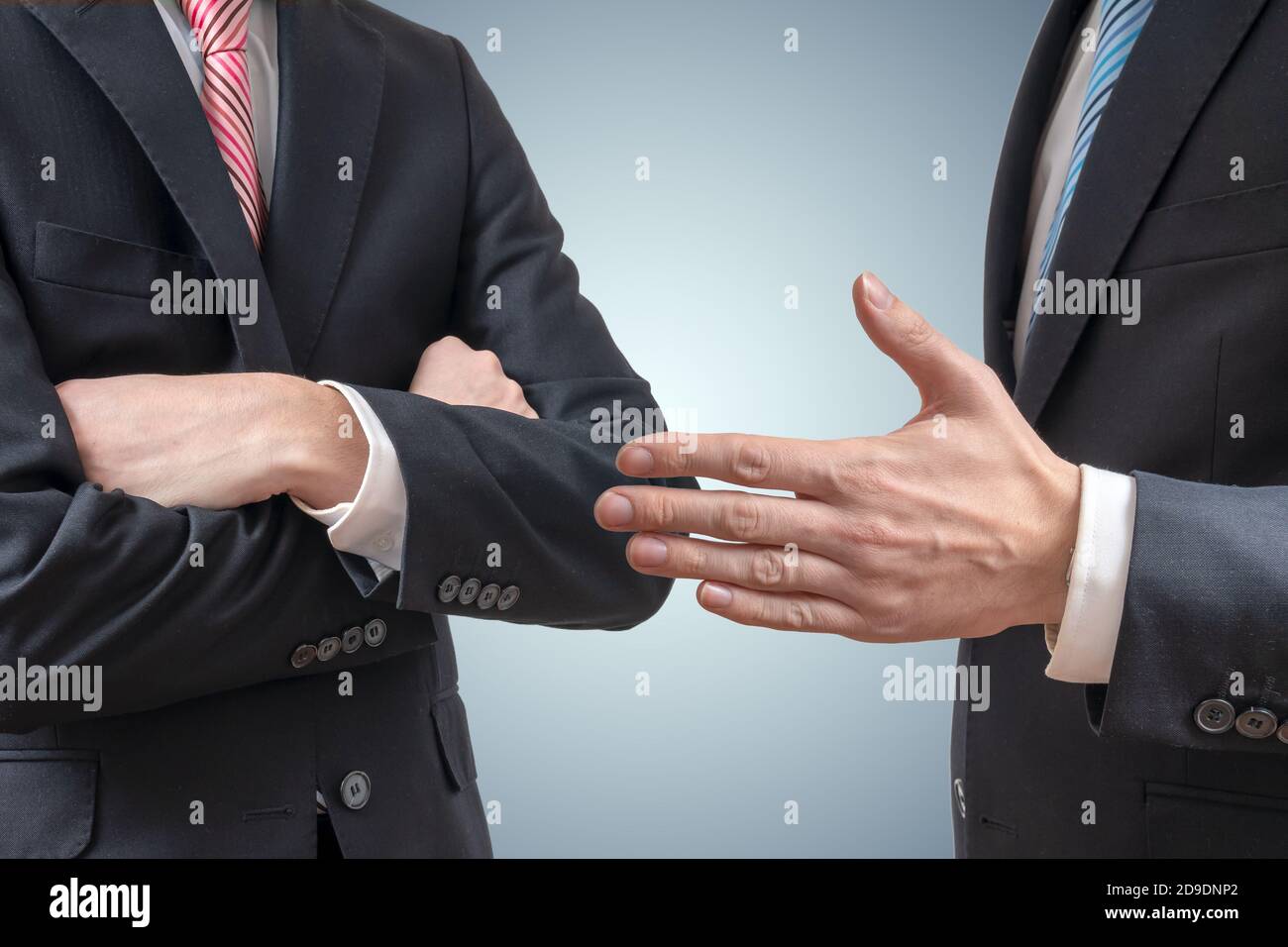 Handshake refuse. Man is refusing shake hand with businessman who is ...
