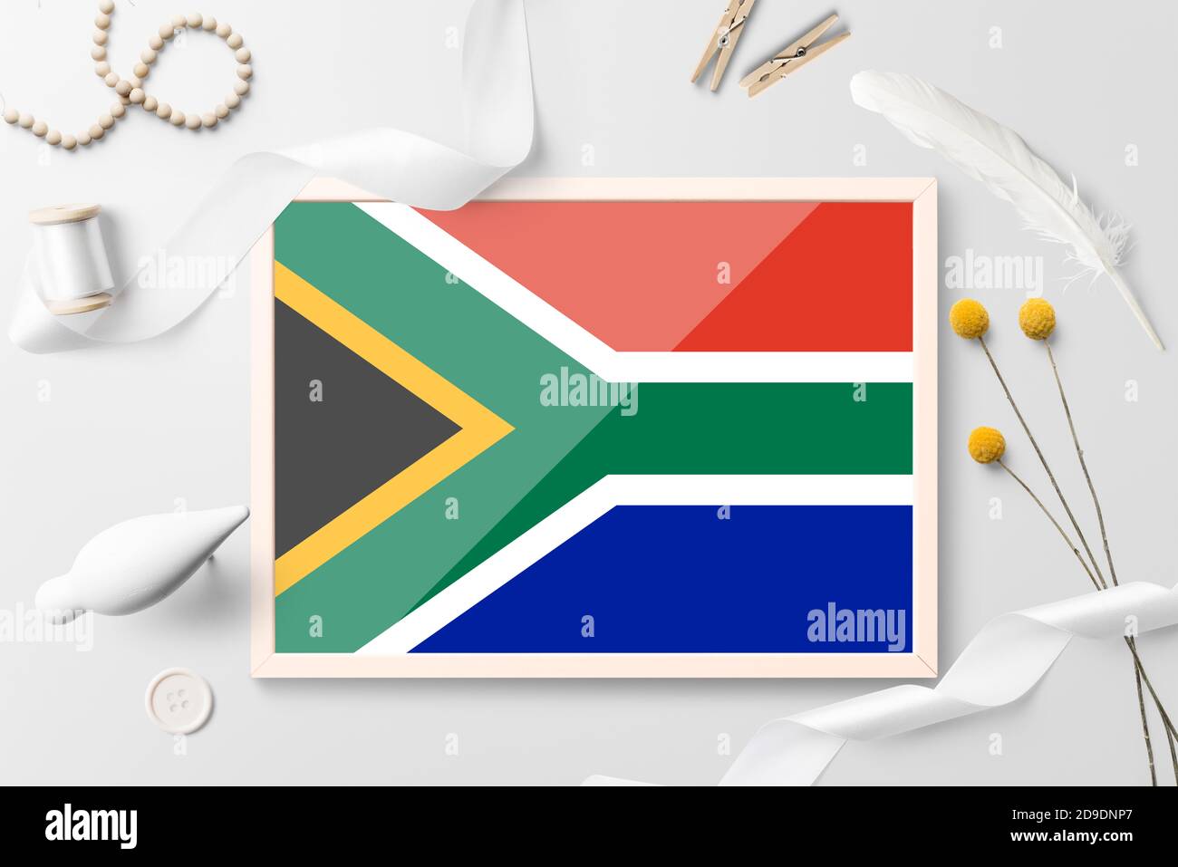 South Africa flag in wooden frame on white creative background. White ...