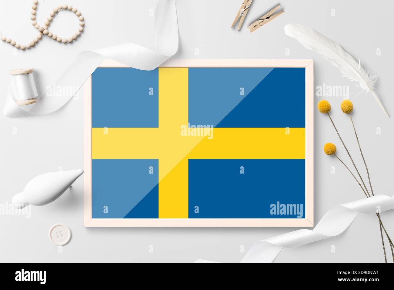 Sweden flag in wooden frame on white creative background. White theme ...