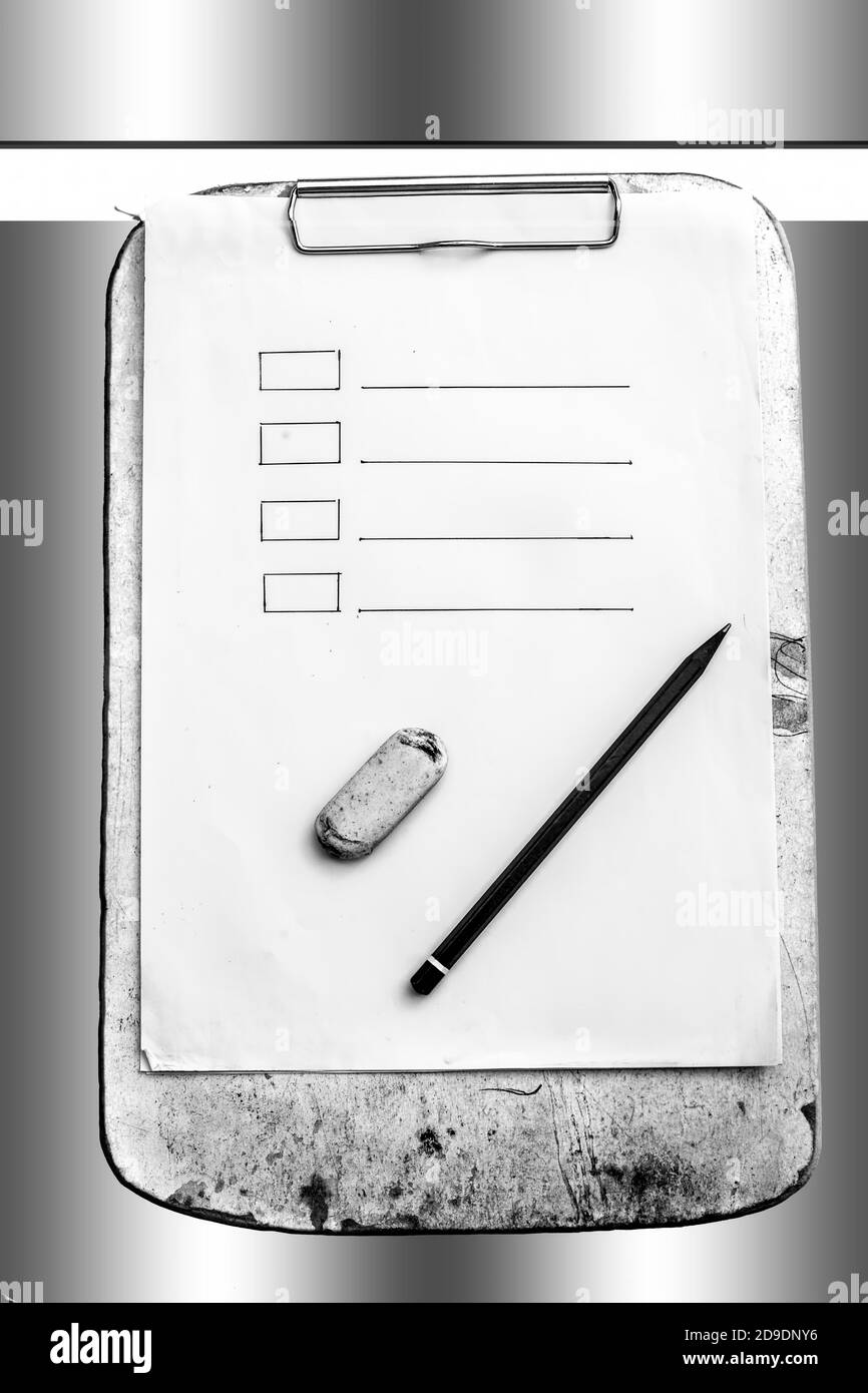 Top shot of a paper and pen with some checkmark list drawn on the paper ...