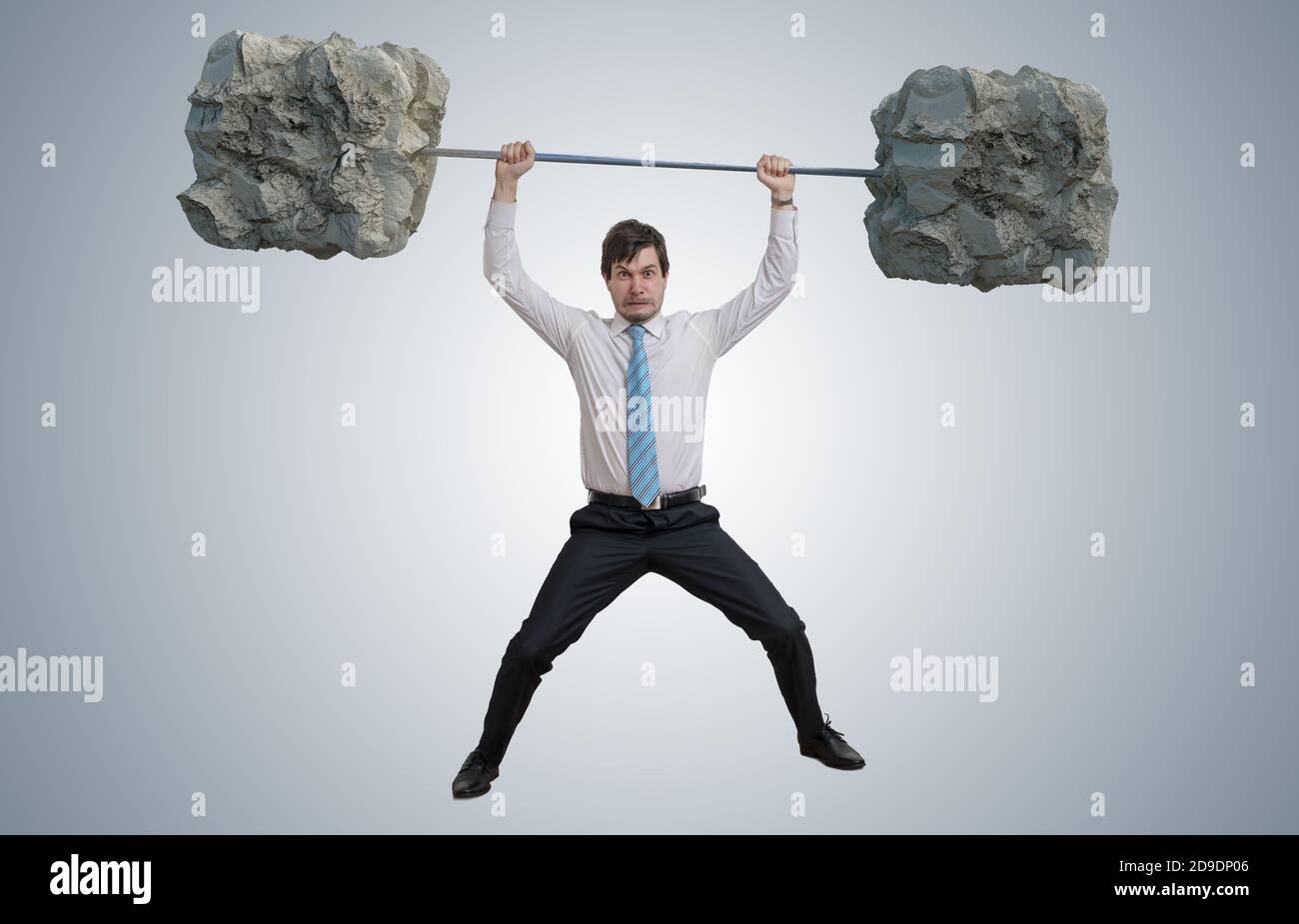 Businessman lifting rock hi-res stock photography and images - Alamy