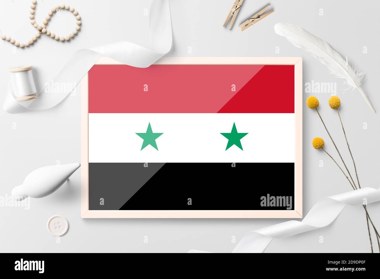 Syria flag in wooden frame on white creative background. White theme ...