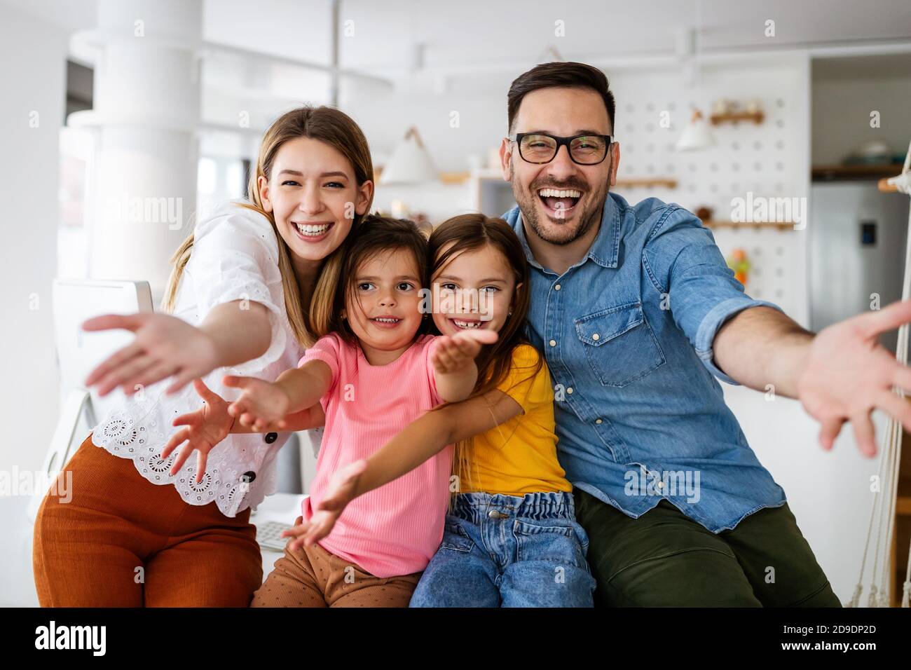 Happy family having fun times at home Stock Photo - Alamy