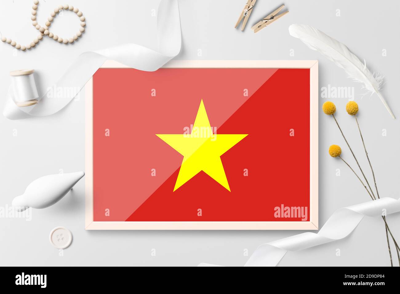 Vietnam flag in wooden frame on white creative background. White theme ...