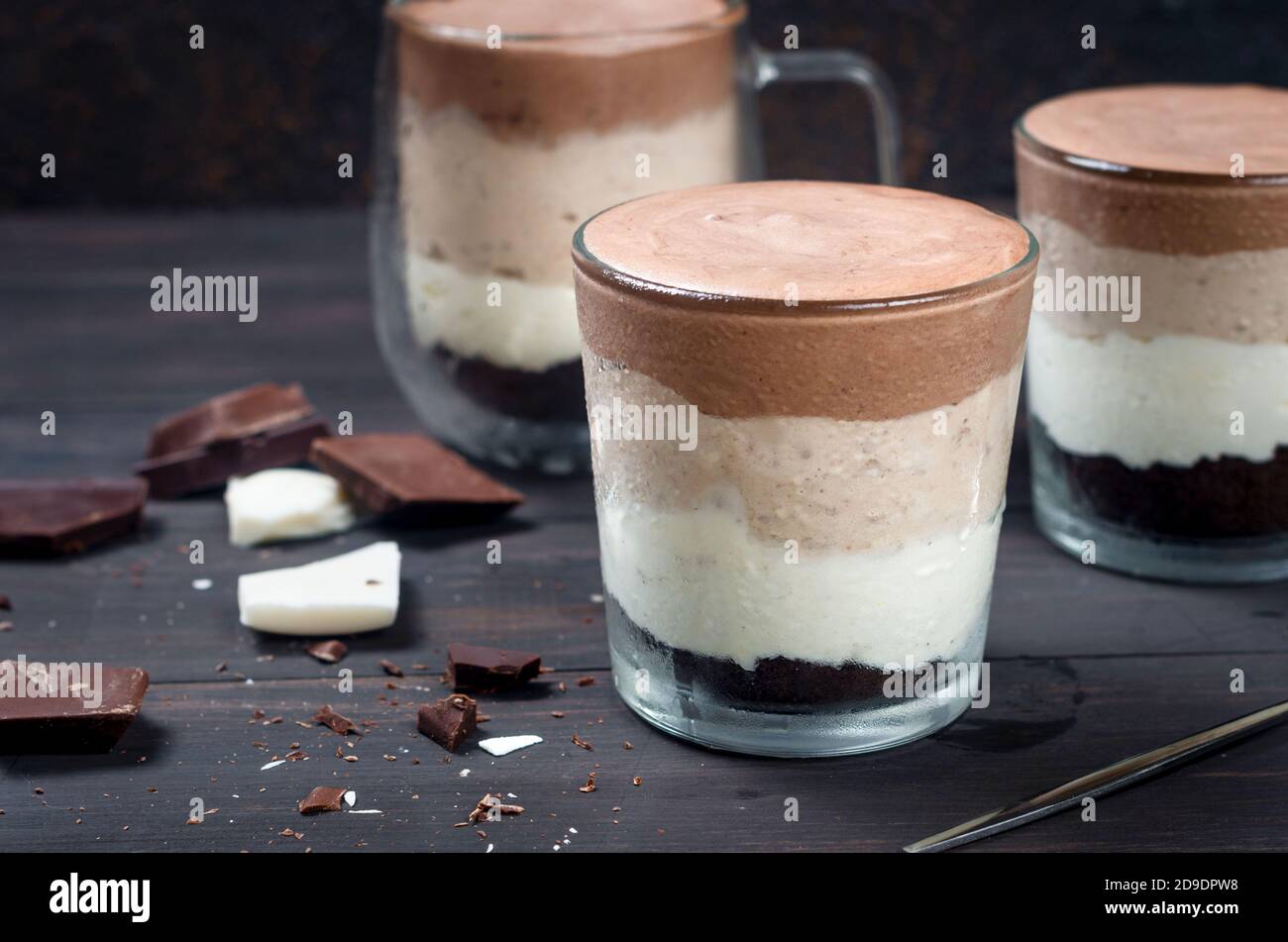 Three glasses of trifle mousse Three Chocolates Stock Photo - Alamy