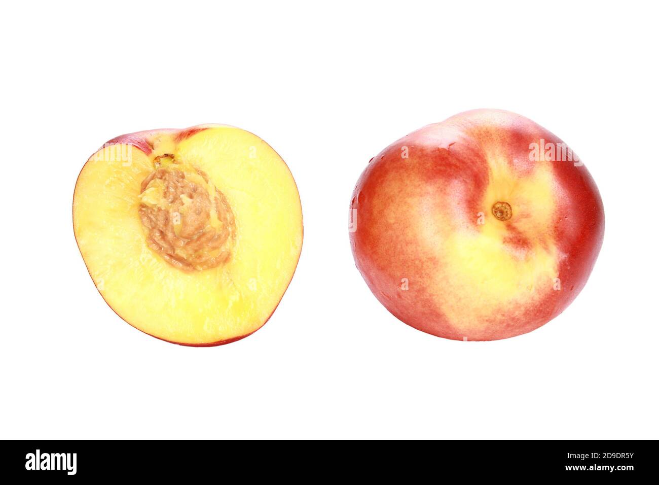 Halved peach next to a whole peach isolated on a white background Stock ...