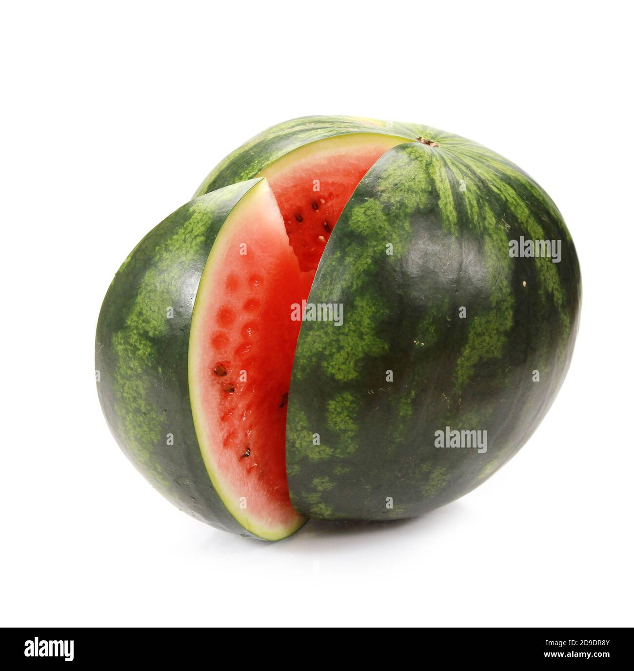Single whole watermelon with a cut slice isolated on a white background ...