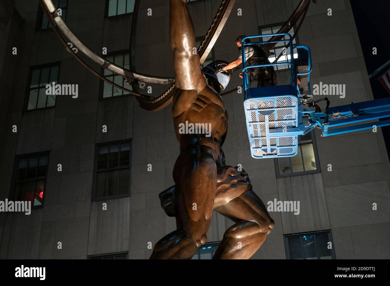 New York, NY - November 4, 2020: Worker attaches facial mask for the ...