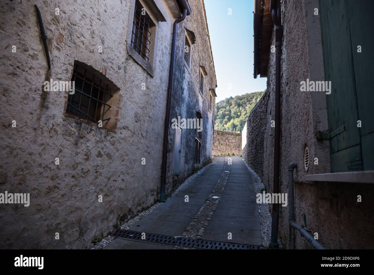 Narrow stone road up between ancient stone buildings Stock Photo - Alamy