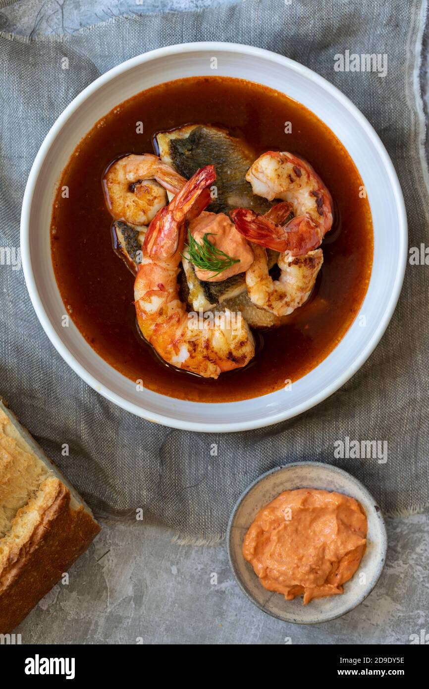 Bouillabaiss, French fish soup with sea bass and prawns Stock Photo - Alamy