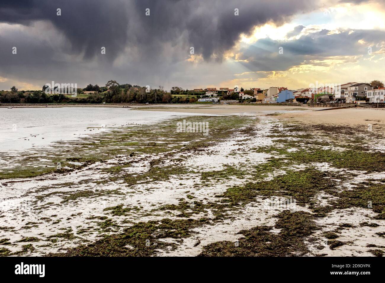 Nice seaside Spanish town during the low tide Stock Photo - Alamy