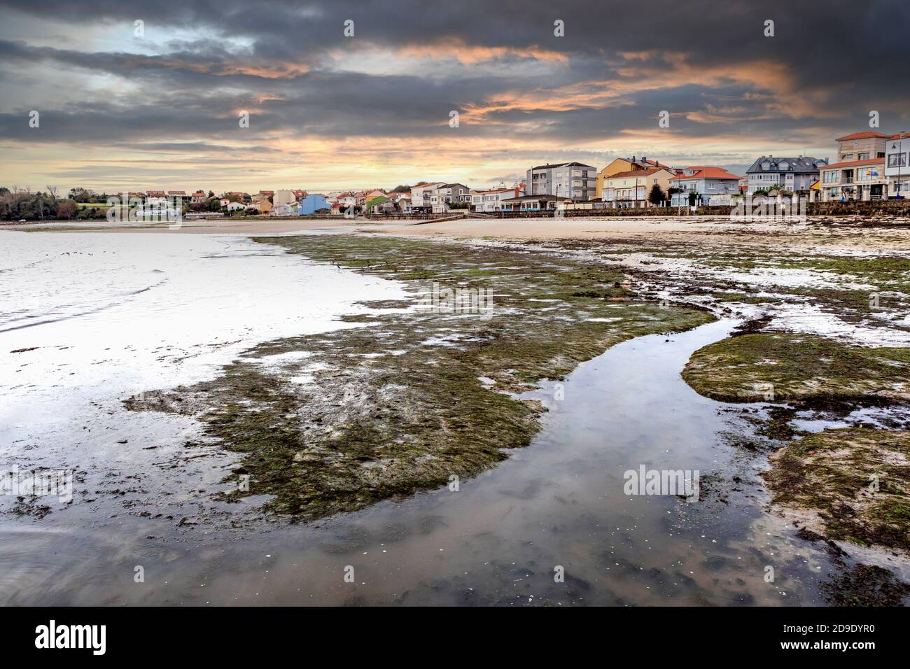 Nice seaside Spanish town during the low tide Stock Photo - Alamy