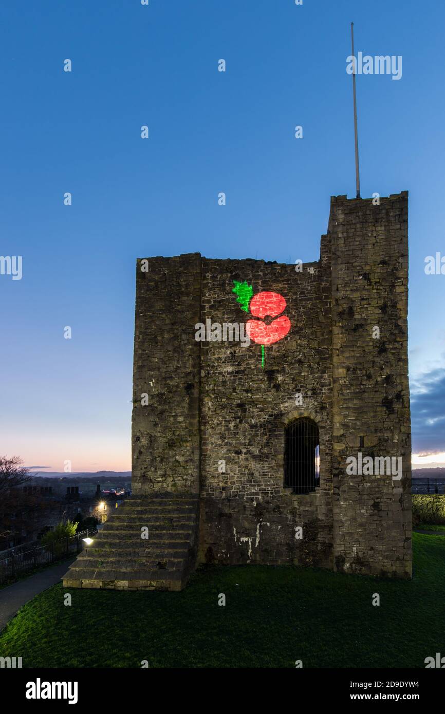 Large red poppy projected onto the wall of Clitheroe castle for ...