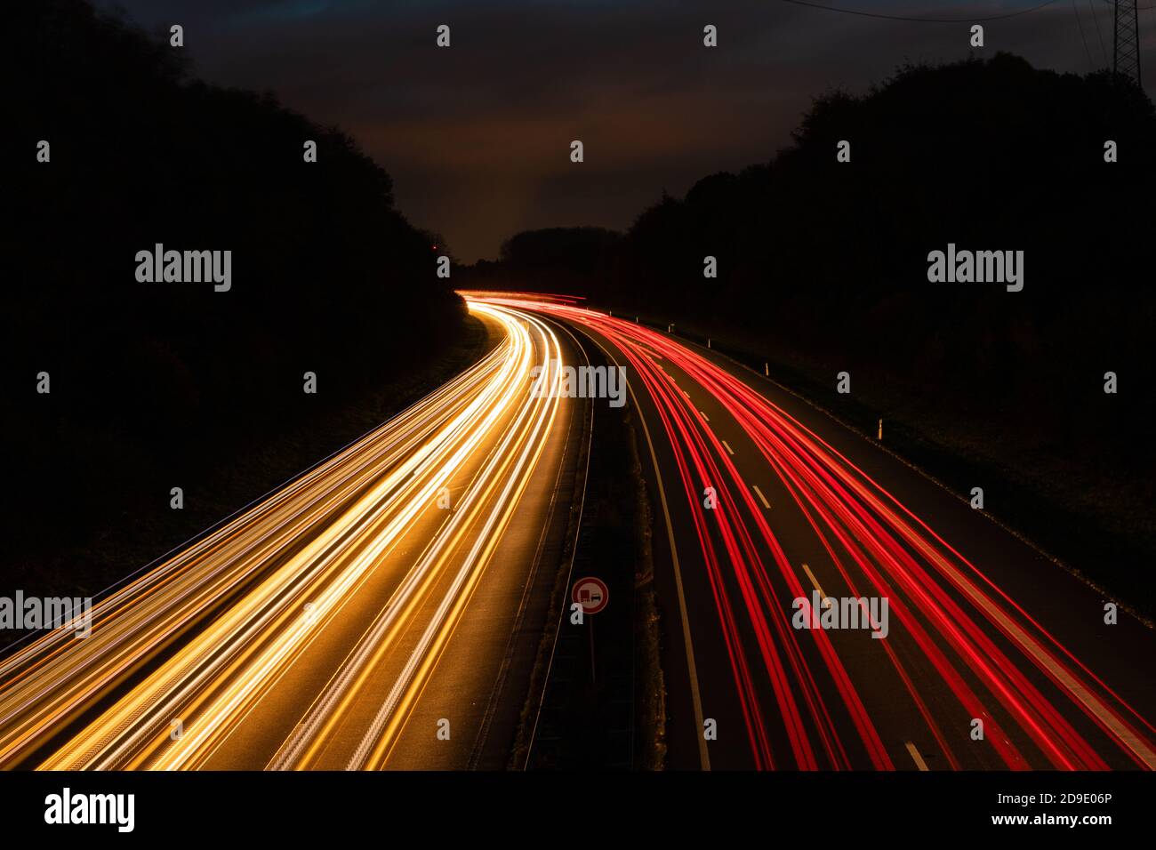 Beautiful and colorful long exposure of the driving cars on the highway ...