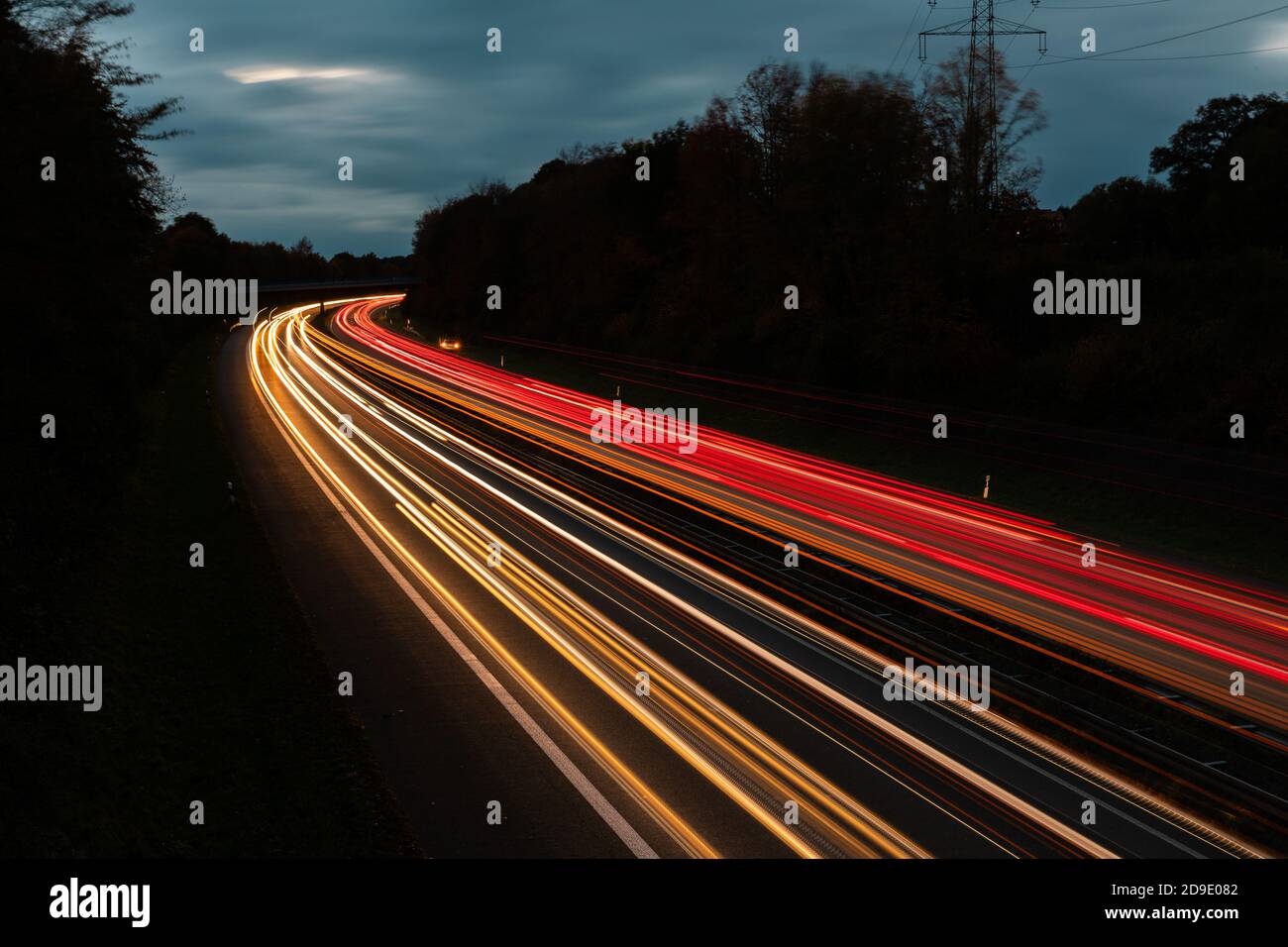 Beautiful and colorful long exposure of the driving cars on the highway ...