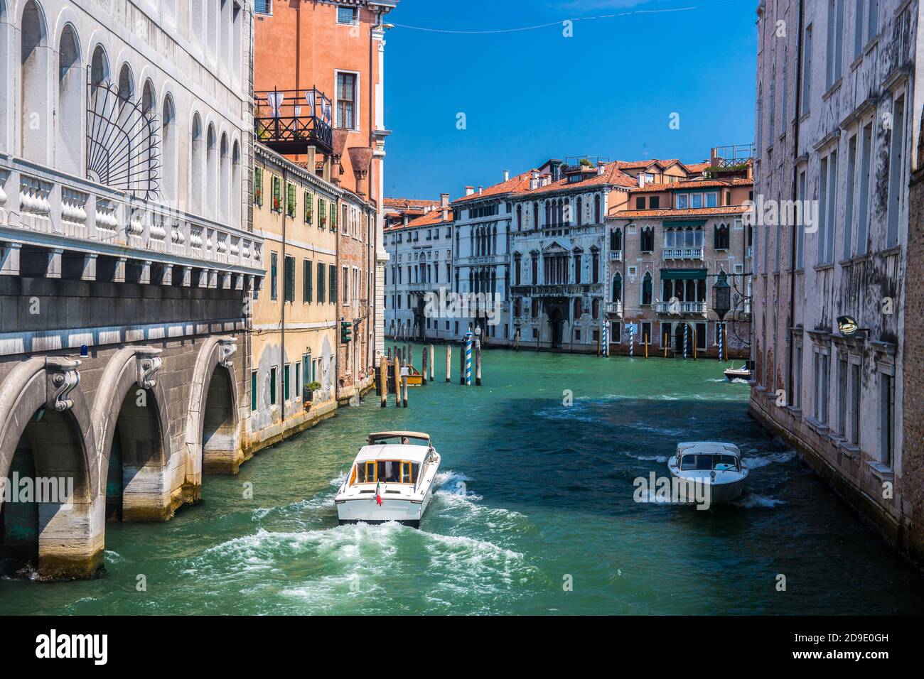 Canal with motorboats in Venice in Italy Stock Photo - Alamy