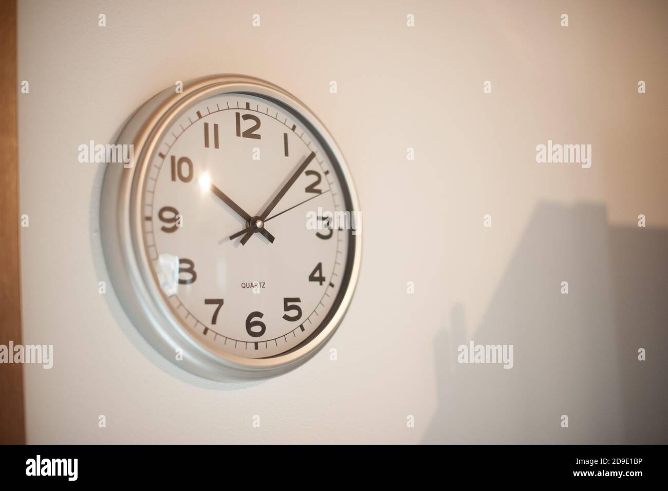 The right time on the wall Stock Photo - Alamy