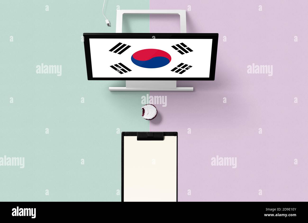 South Korea national flag on computer screen top view, cupcake and ...