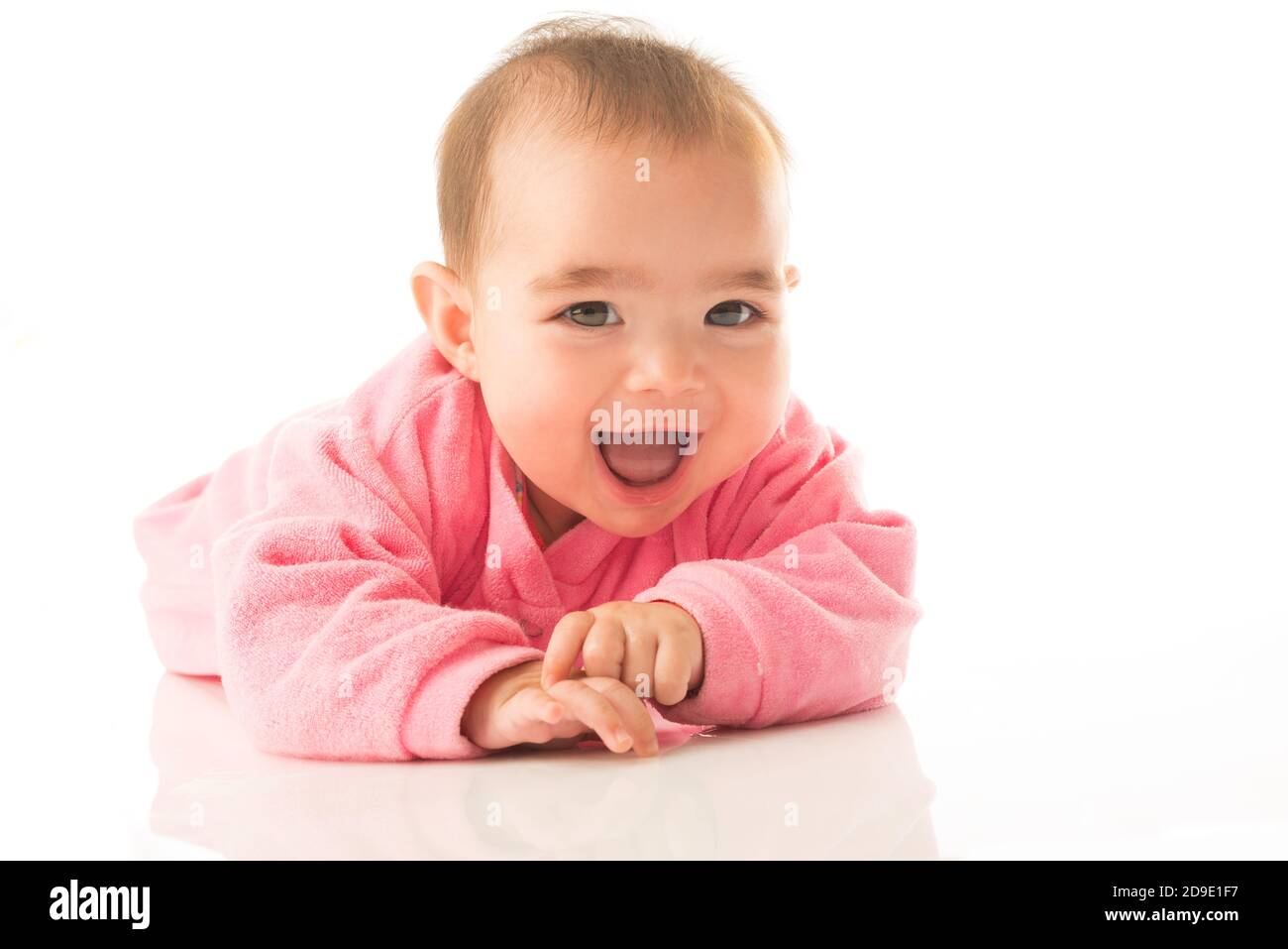 6 month old baby girl looking straight at camera Stock Photo - Alamy