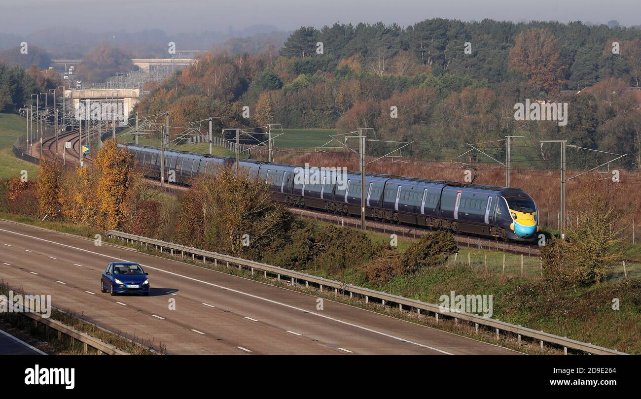 A southeastern high speed train wears a painted blue mask as it passes ...