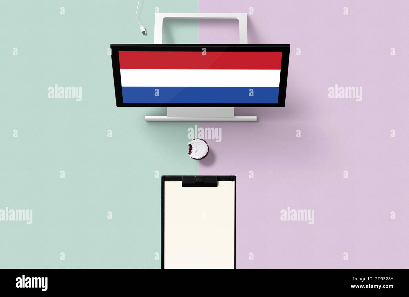 Netherlands national flag on computer screen top view, cupcake and ...