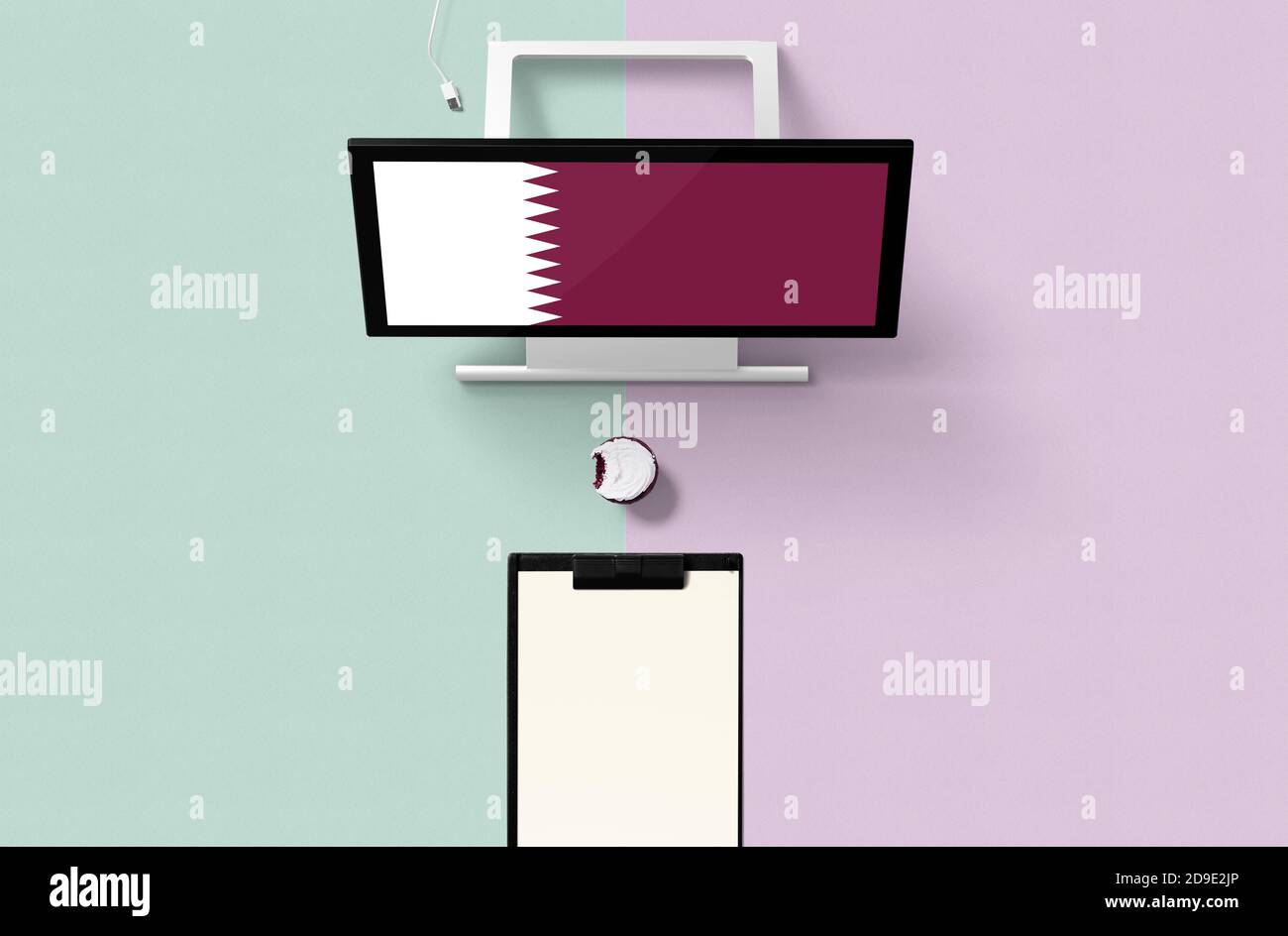 Qatar national flag on computer screen top view, cupcake and empty note ...