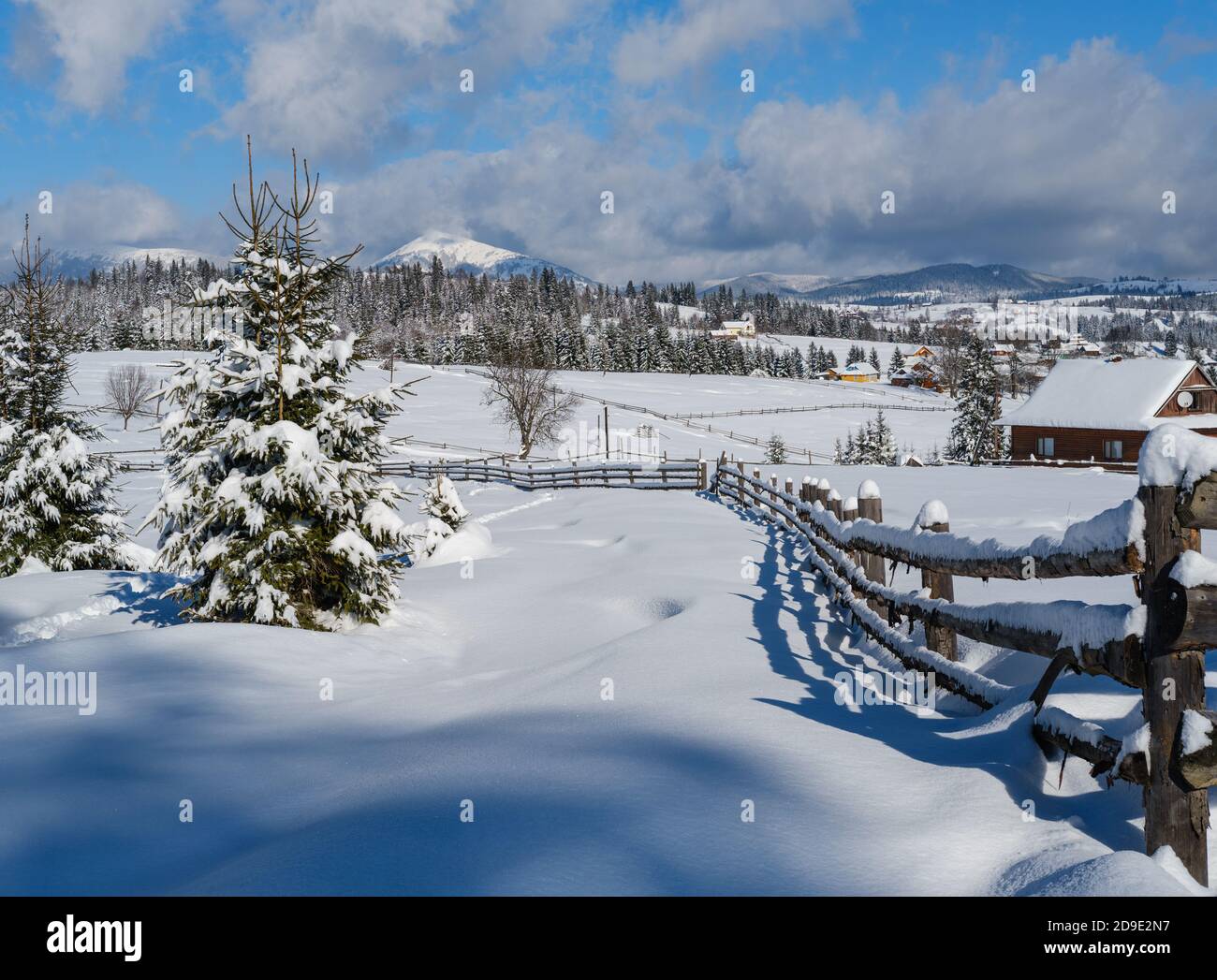 Winter remote alpine mountain village outskirts, countryside hills ...