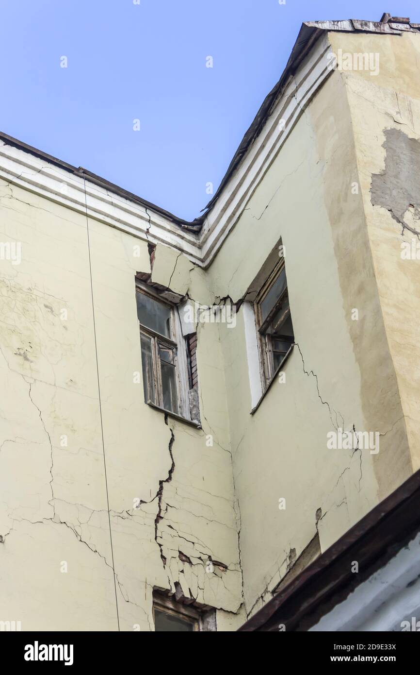 The old house is crumbling. Cracks run along the wall and windows ...