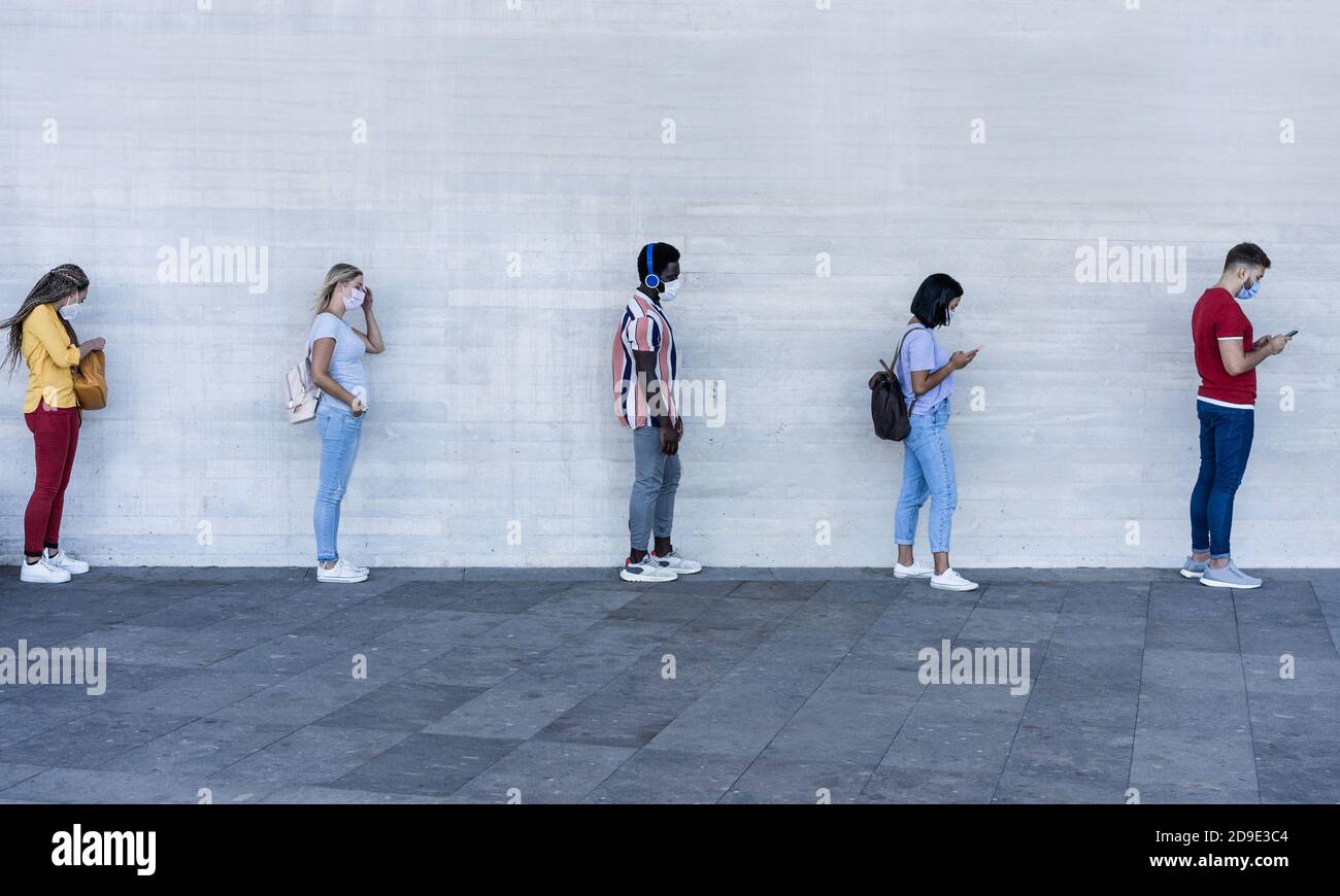 Group of young people waiting for going inside a shop market while ...