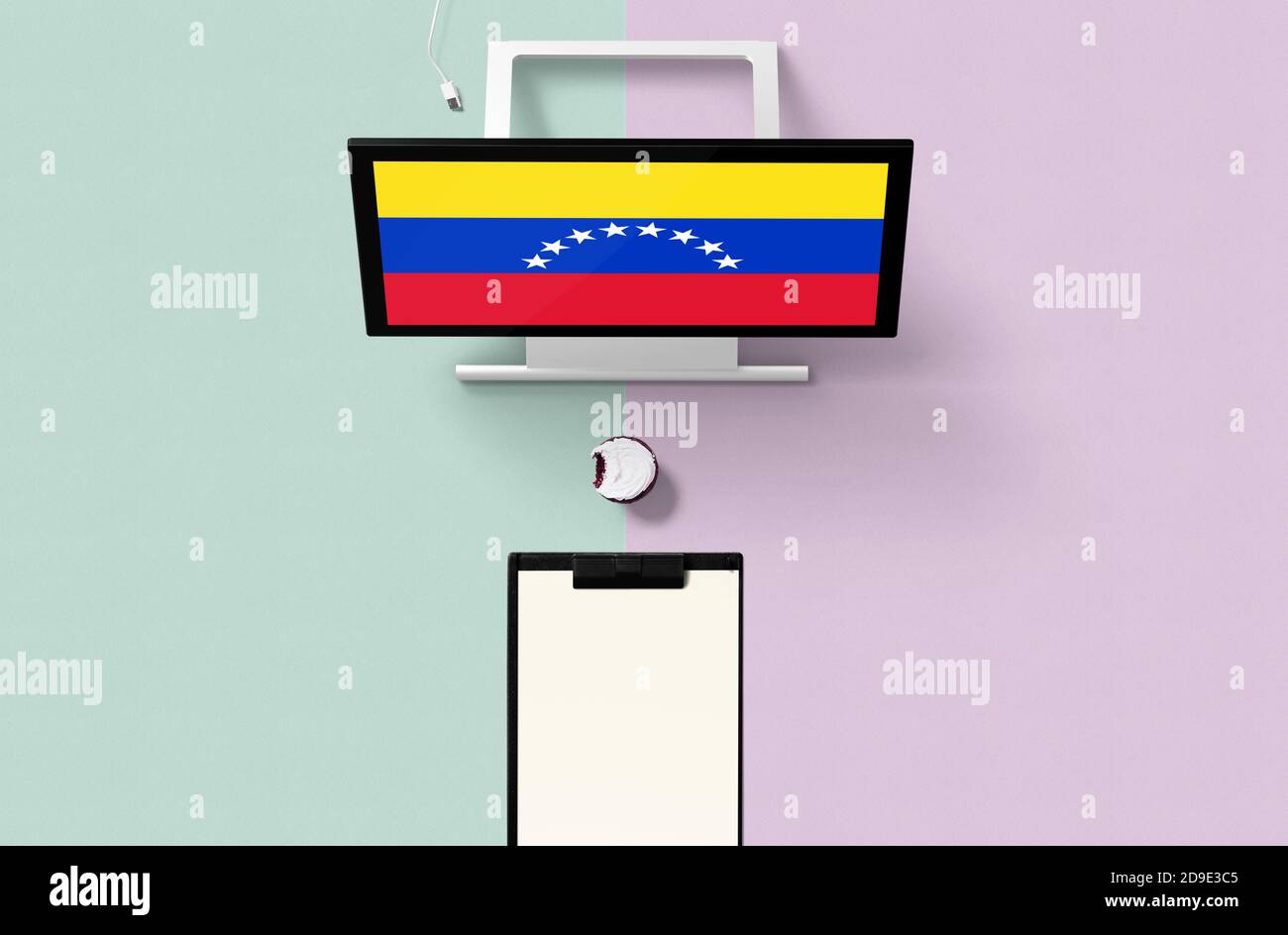 Venezuela national flag on computer screen top view, cupcake and empty ...