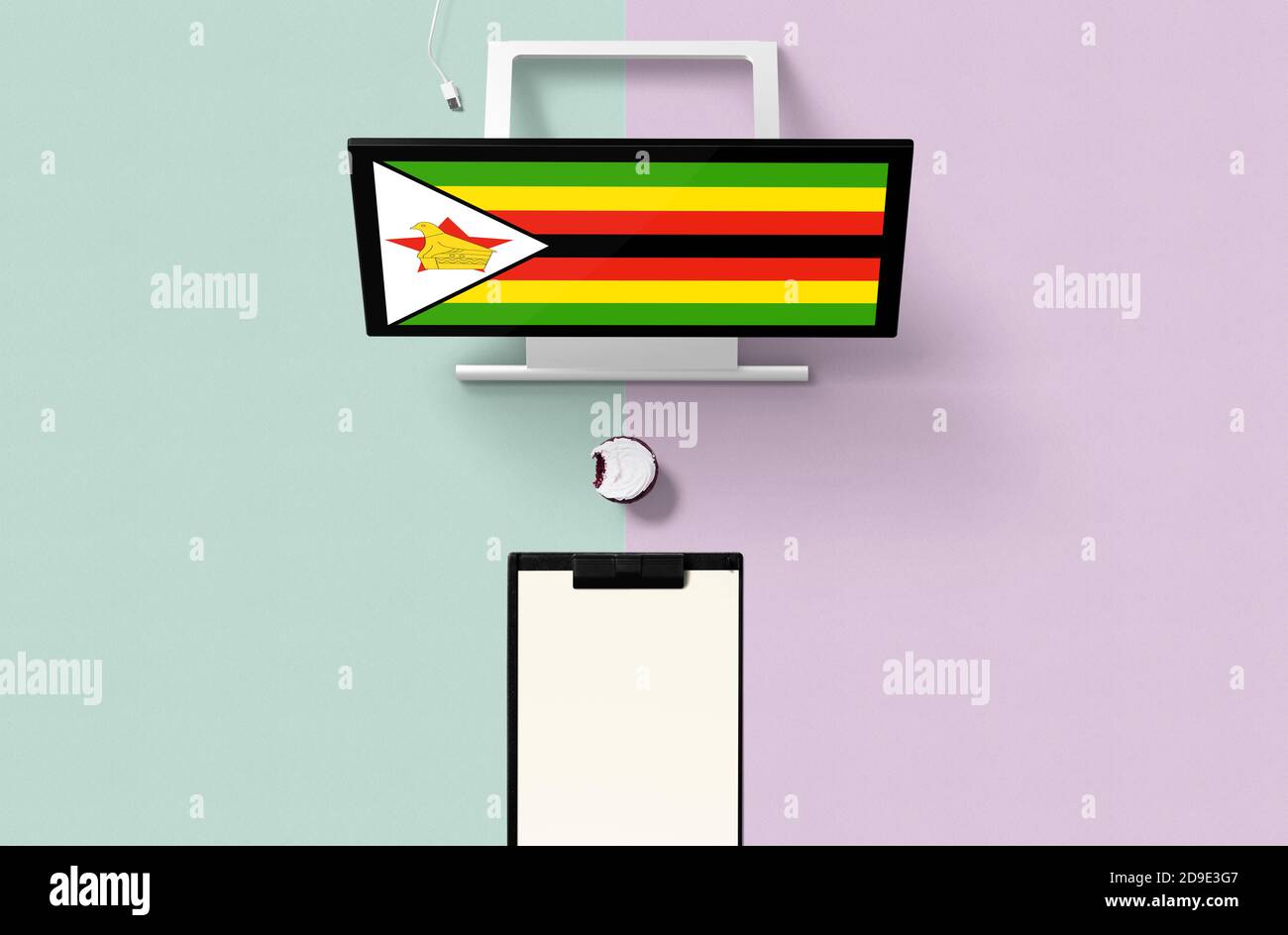 Zimbabwe national flag on computer screen top view, cupcake and empty ...