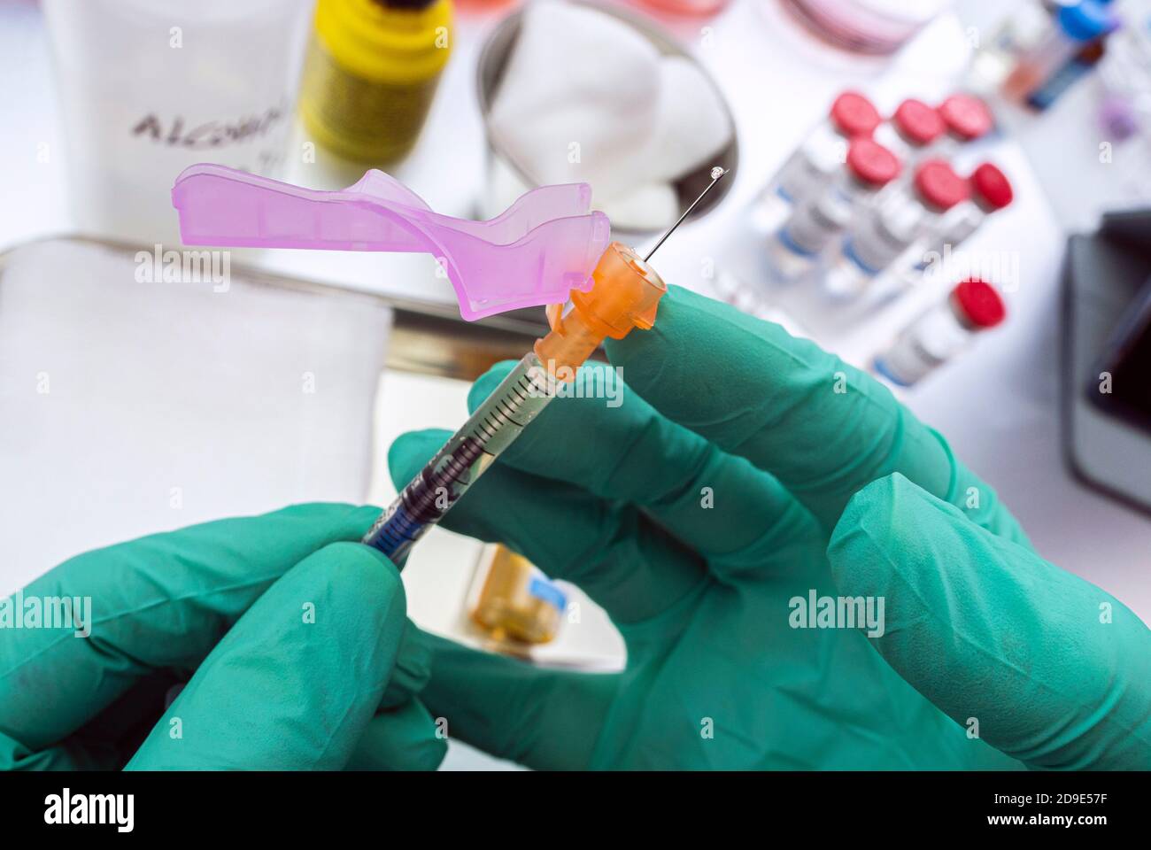 Nurse preparing a medical syringe in a hospital, conceptual image Stock ...