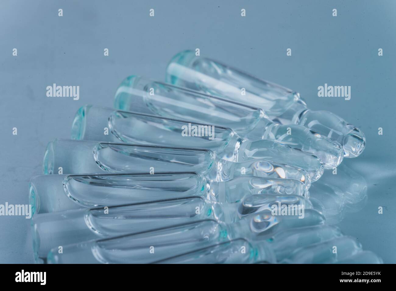 Glass medical ampoule vial for injection. Medicine is dry white drug ...