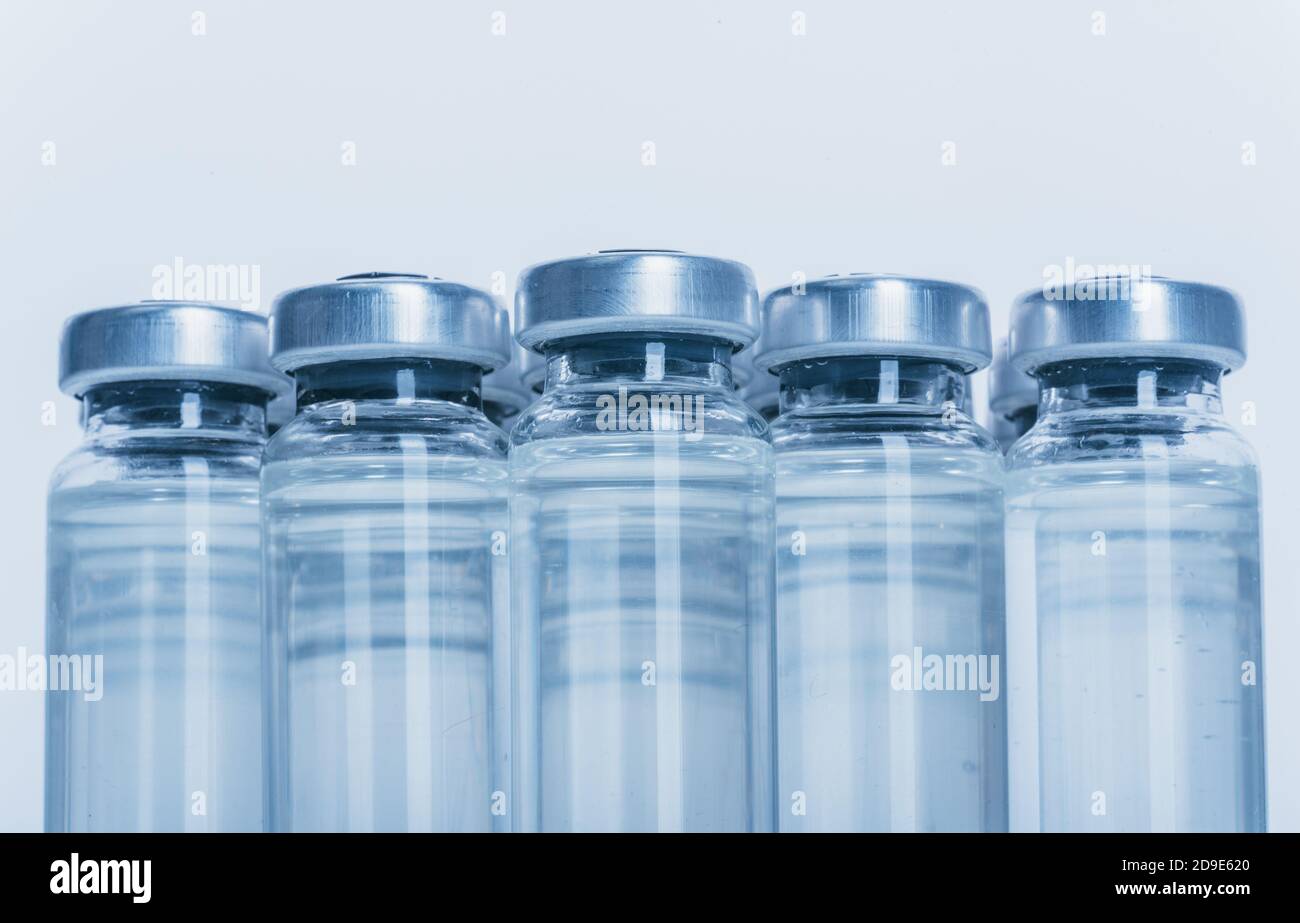 Glass medical ampoule vial for injection. Medicine is dry white drug ...