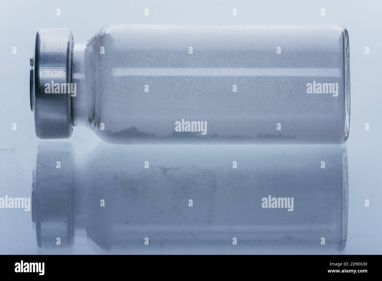 Glass medical ampoule vial for injection. Medicine is dry white drug ...